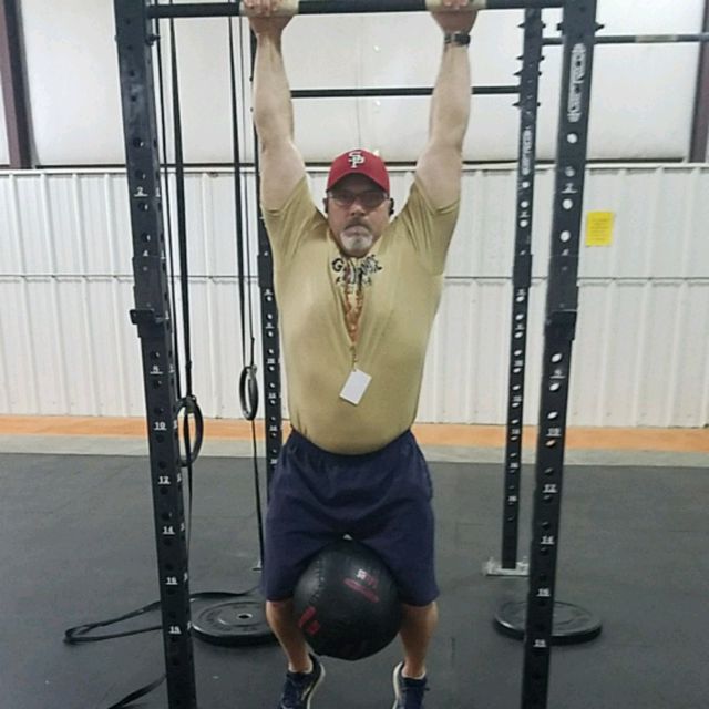 Weighted Knees To Chest by Michael Towles - Exercise How-to - Skimble