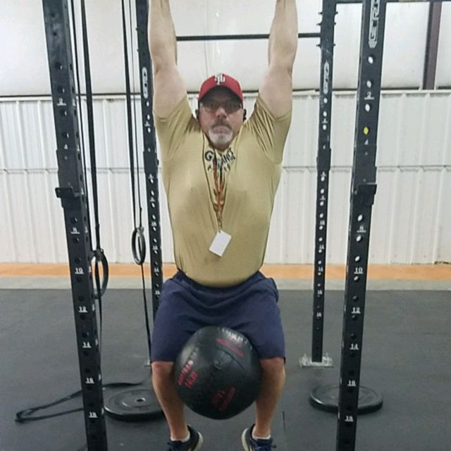 Weighted Knees To Chest by Michael Towles - Exercise How-to - Skimble